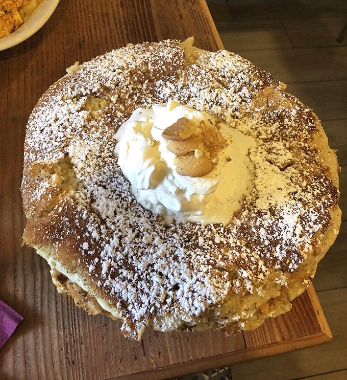 This isn't just a pancake &ndash; it's a structural engineering marvel with whipped cream architecture that defies both gravity and restraint.