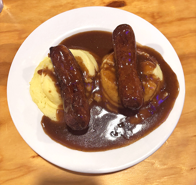Bangers and mash: where sausages meet potato clouds in a pool of rich gravy. British comfort food at its most comforting.