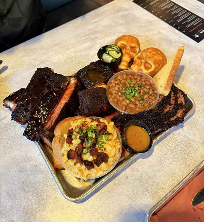 A barbecue platter that showcases the full range of smoky excellence, complete with all the essential sides.