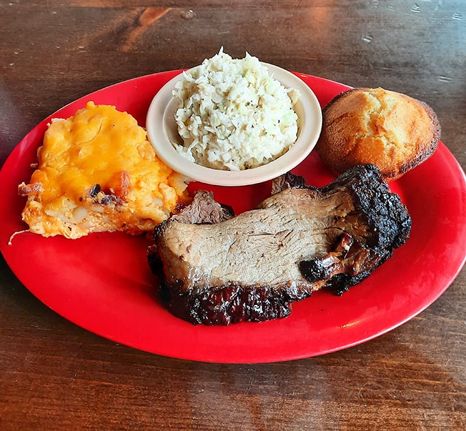Brisket with a smoke ring so perfect it could be framed in a museum, alongside sides that refuse to be overshadowed by the main attraction.