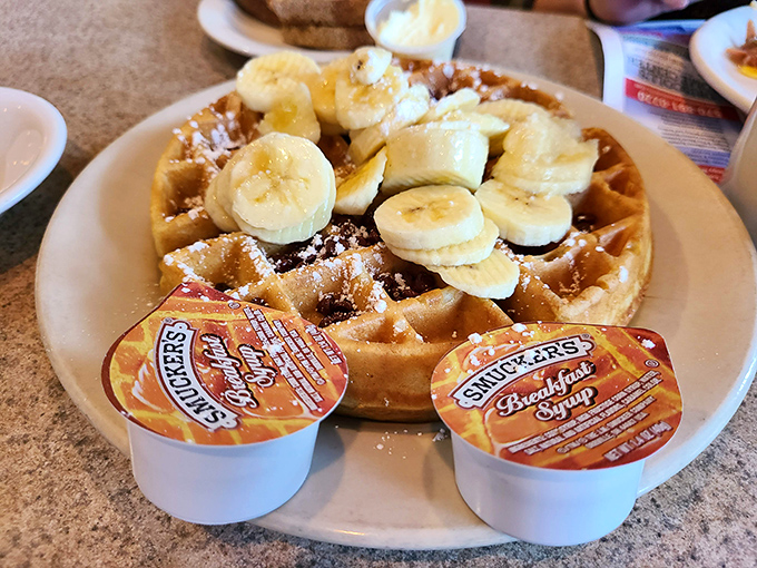 Whoever said "money can't buy happiness" clearly never met this Belgian waffle topped with bananas and waiting for syrup to complete the magic.