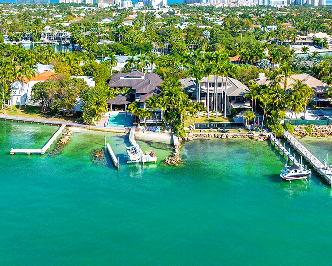Homes with private docks line the emerald canals, creating a neighborhood where "popping over to the neighbors" often involves a paddleboard rather than a sidewalk.