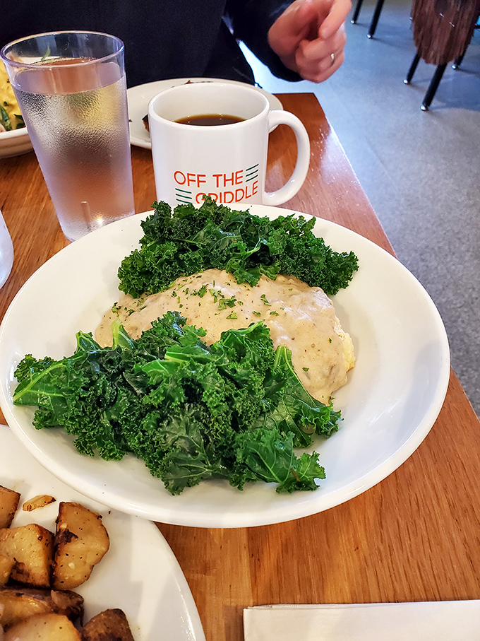 Kale never looked so appealing, surrounding what appears to be a creamy centerpiece. Even vegetable skeptics might be converted by this artful arrangement.