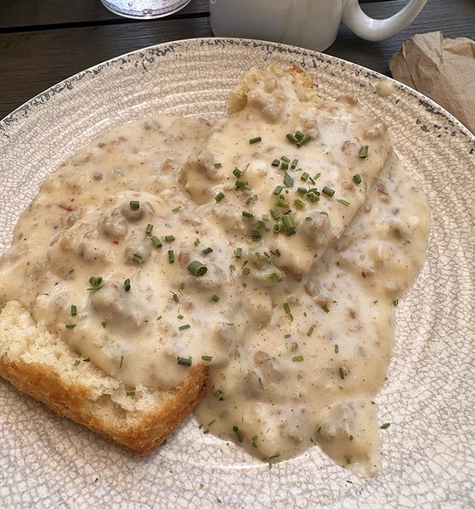 This isn't just biscuits and gravy&mdash;it's a cloud of comfort floating in a sea of savory satisfaction, garnished with hope for a better day.