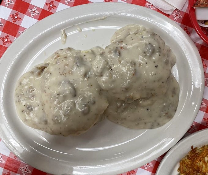 Biscuits and gravy so good they deserve their own ZIP code. This is what breakfast clouds must look like in heaven.