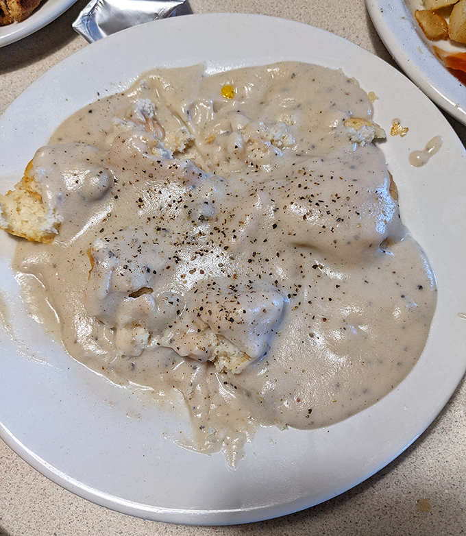 Biscuits and gravy that could settle family feuds. This pepper-speckled blanket of comfort is breakfast nirvana on a plate.