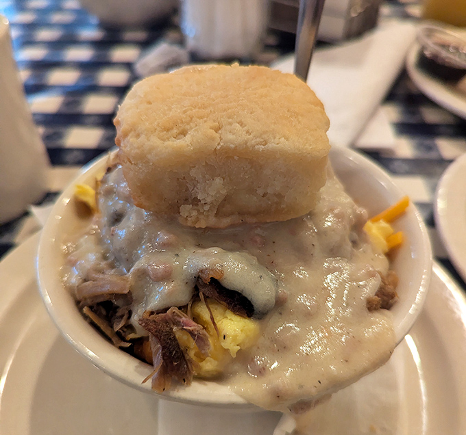 Not just biscuits and gravy&mdash;it's a Southern baptism by cream sauce with a biscuit hat perched atop like a delicious crown.