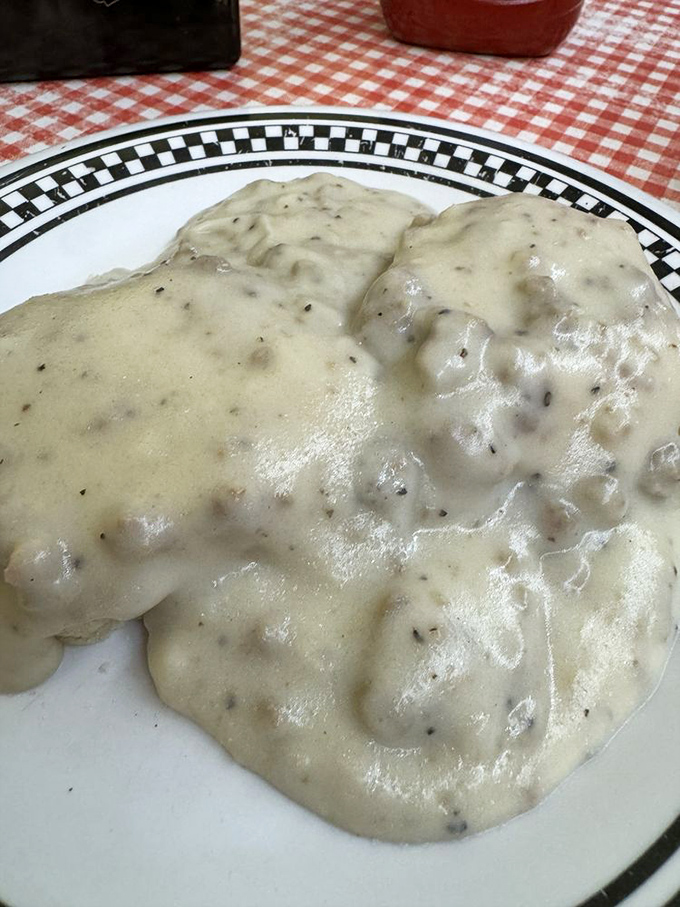 Biscuits hiding beneath a lava flow of homemade sausage gravy. Some people climb mountains, I conquer breakfast plateaus like this.