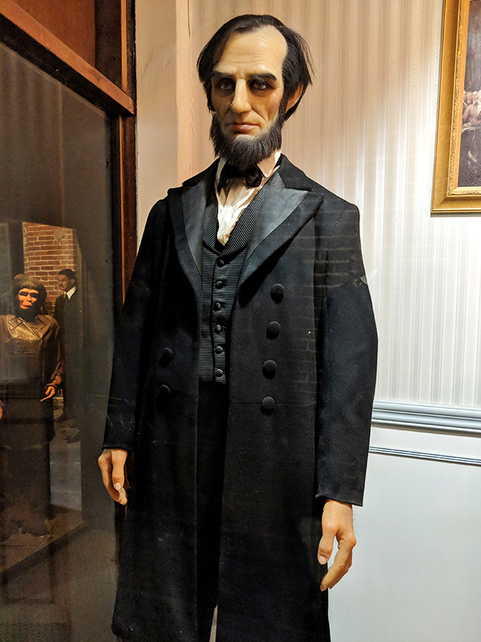 Honest Abe stands tall in his Sunday best, his expression suggesting he's just remembered he left the stove on at the White House.