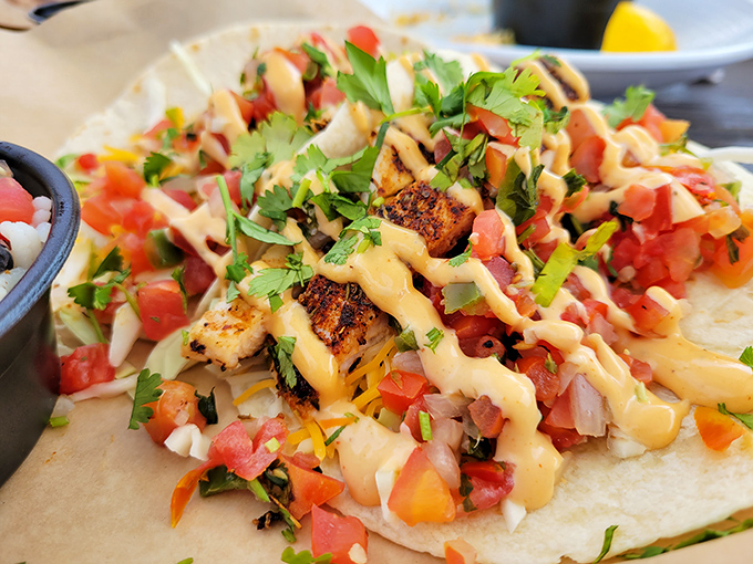 Blackened fish tacos that bring the heat and the sweet – like that summer romance you still think about, but with better garnish.