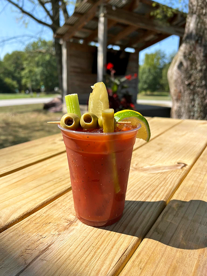 This Bloody Mary isn't just a drink&mdash;it's a garden party in a cup, complete with olives standing at attention like they're guarding liquid treasure.