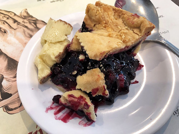 Blueberry pie that's worth every sticky-fingered, purple-tongued moment. The crust-to-filling ratio here is mathematical perfection.