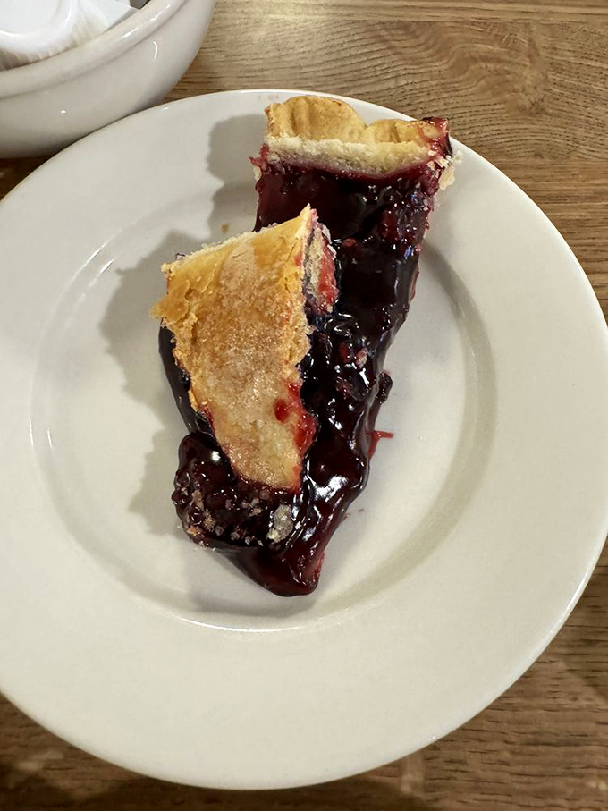 This isn't just blueberry pie; it's summer afternoon memories captured in a perfect balance of flaky crust and juicy berries.