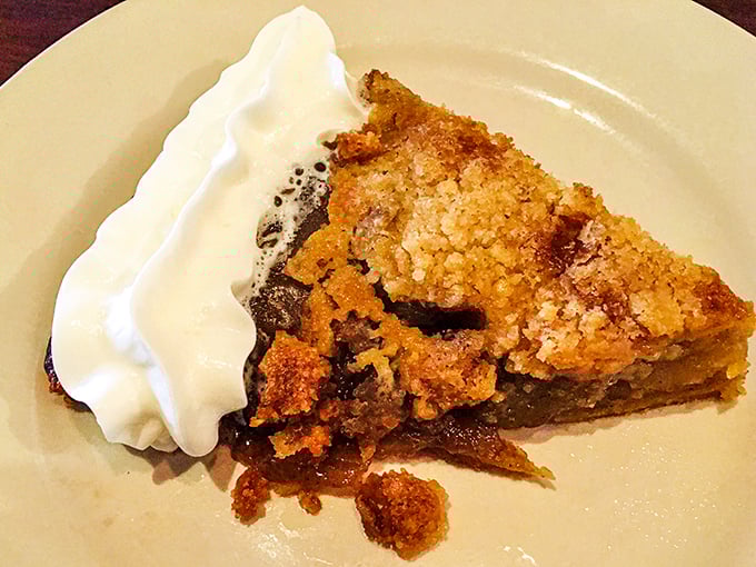 Bourbon apple pie with a cloud of whipped cream. Grandma would approve, then ask for the recipe while pretending not to be jealous. 