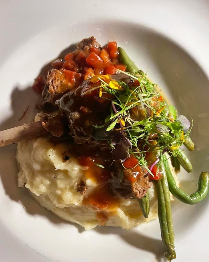 Fork-tender braised short ribs perched atop creamy mashed potatoes. The kind of comfort food that makes you want to hug the chef.