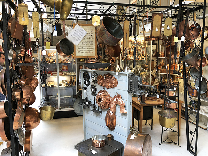 Copper and brass treasures hang like metallic fruit, ripe for the picking. Julia Child would have a field day in this kitchen wonderland.