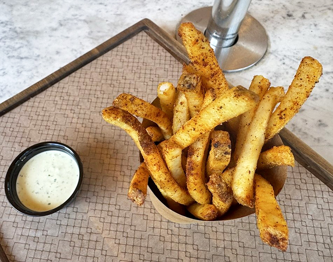 Brassica's fries aren't just a side dish&mdash;they're the main event's worthy co-star. Crispy, seasoned perfection that will ruin regular fries for you forever.