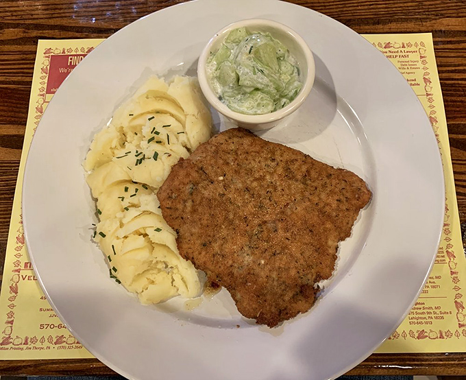 The breaded pork chop that launched a thousand road trips. Crispy exterior, juicy interior, and that cucumber salad&mdash;a refreshing counterpoint to meat perfection.