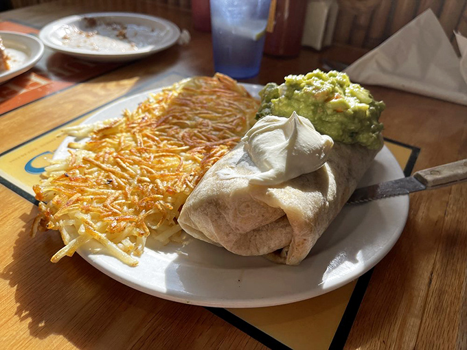 Breakfast burritos should always be this photogenic&mdash;crispy hash browns, fresh guacamole, and a tortilla wrapped tighter than your vacation budget.