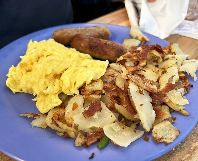 The breakfast trinity: perfectly scrambled eggs, sausage links with just the right snap, and those legendary stove potatoes that haunt dreams long after leaving Mammoth.