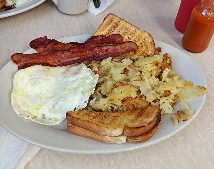 Breakfast perfection doesn't need fancy plating&mdash;just perfectly crisp hash browns, eggs your way, and toast that's actually toasted right. The holy grail of morning meals.