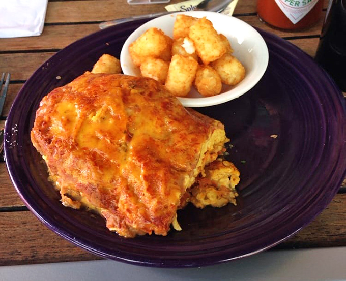 Breakfast goes south of the border with this cheese-blanketed enchilada that makes you wonder why more morning meals don't wear melted cheese hats.