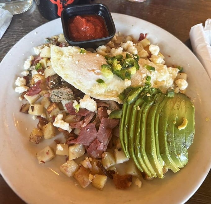 Breakfast alchemy at its finest&mdash;crispy potatoes, perfectly cooked eggs, and avocado sliced with the precision of a Swiss watchmaker.