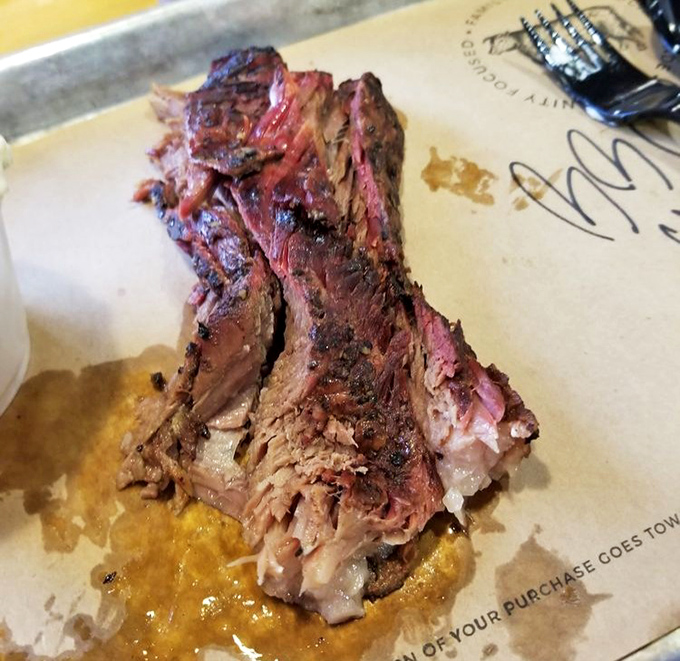 Brisket so perfectly smoked it makes Texans nervous. That pink smoke ring is the BBQ equivalent of a Michelin star.