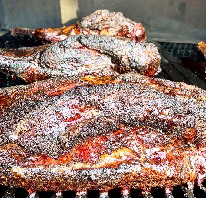 The brisket glistens with a promise kept &ndash; hours of patient smoking transformed into meat magic. This is what smoke dreams are made of.
