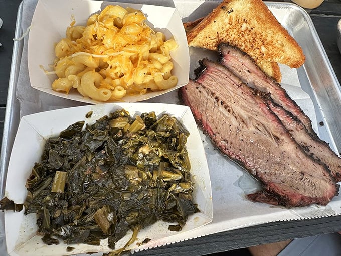 A tray of brisket, collard greens, and mac and cheese&mdash;the holy trinity of Southern comfort that speaks directly to your soul.