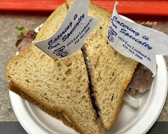 The humble brisket sandwich, elevated to art form. Two toothpick flags stand guard over this masterpiece, as if claiming territory for Delicious-stan.