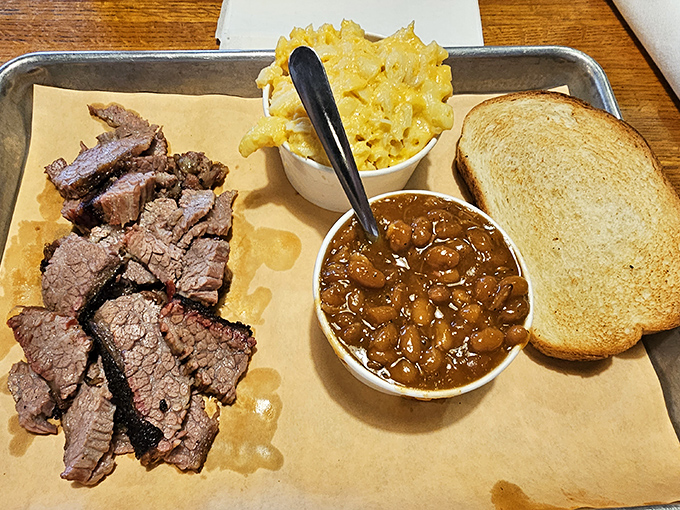 Brisket sliced thick enough to make a Texan nod in approval, with beans that have clearly been simmering since breakfast.