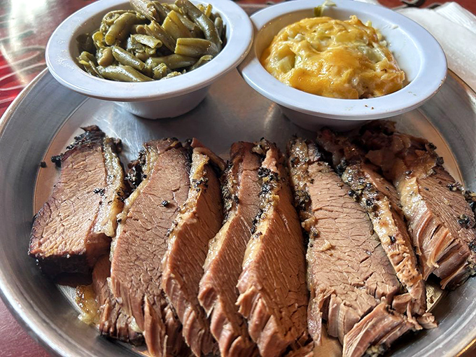 Brisket sliced so perfectly it could make a Texas pitmaster weep with joy. Those sides aren't playing backup&mdash;they're co-headlining this delicious show.