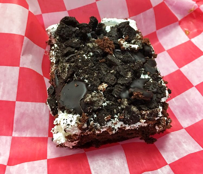 A brownie so decadent it should come with a warning label. That chocolate-to-cream ratio suggests someone who truly understands the meaning of generosity.