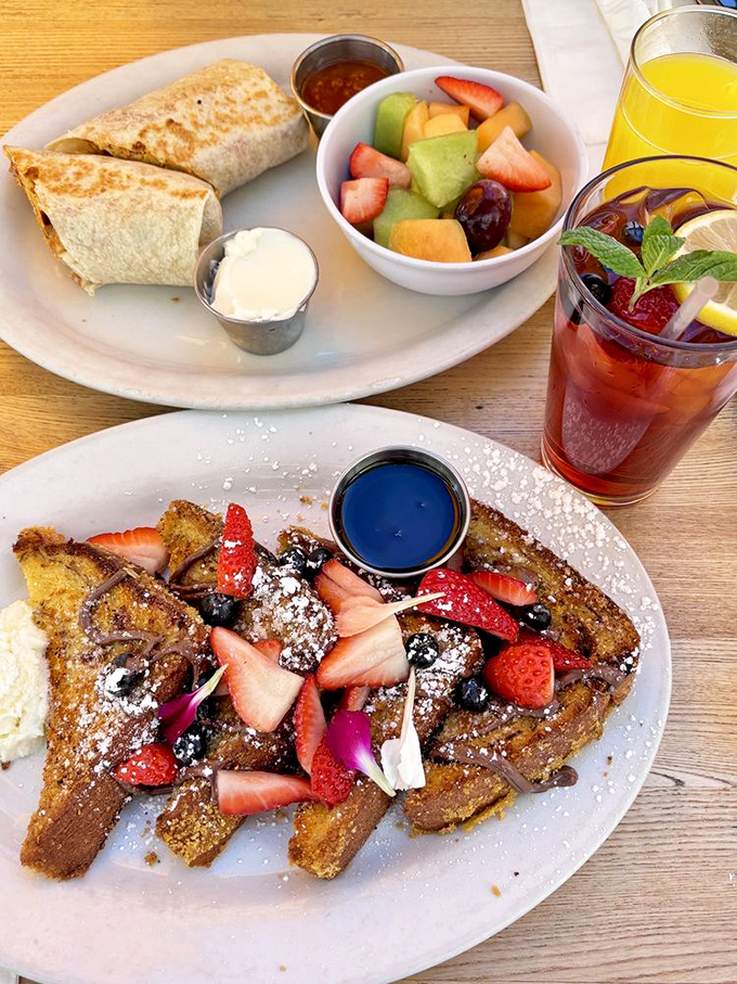 French toast that's dressed for success with fresh berries and powdered sugar, while a breakfast burrito waits patiently in the wings.