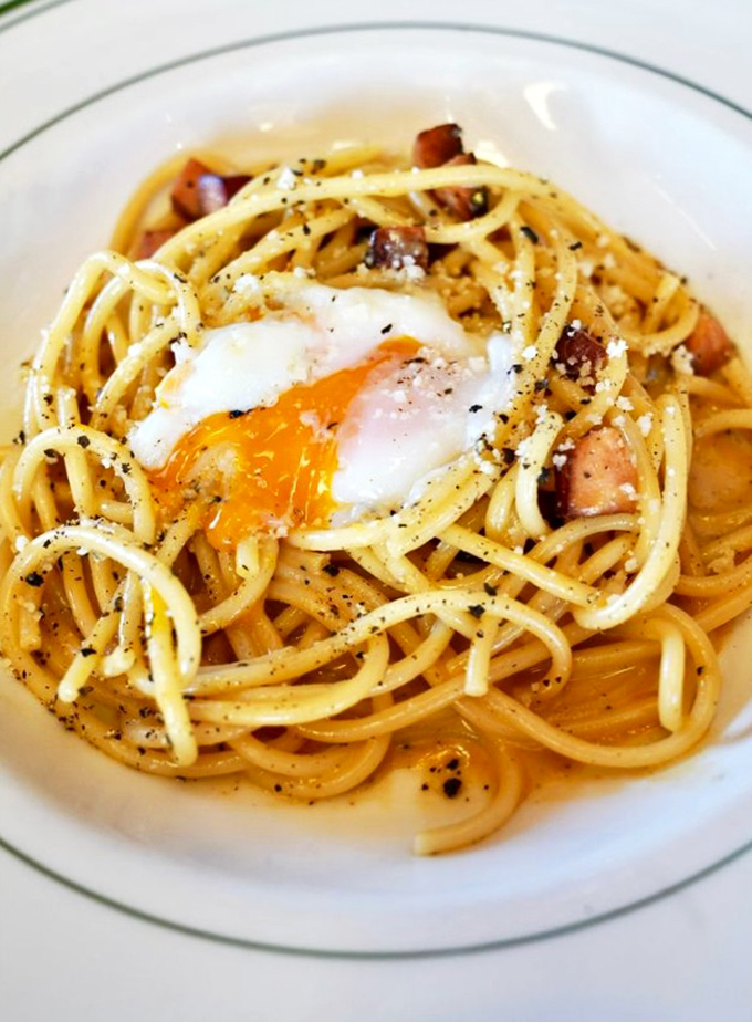 The Bucatini Carbonara with its perfectly runny egg transforms pasta into poetry&mdash;swordfish "bacon" adding a brilliant maritime twist to an Italian classic.