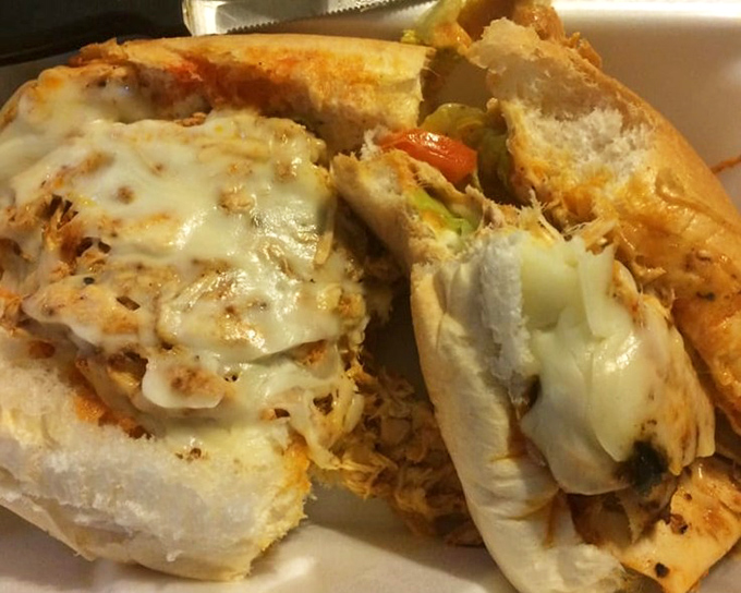 This chicken sandwich has more cheese than your uncle's jokes at Thanksgiving. The melty blanket covers tender meat like it's protecting a secret recipe.