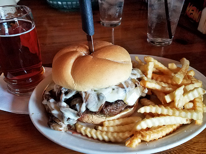 This isn't just a burger&mdash;it's an architectural marvel of mushrooms and melted cheese that requires both hands, several napkins, and absolutely zero shame.