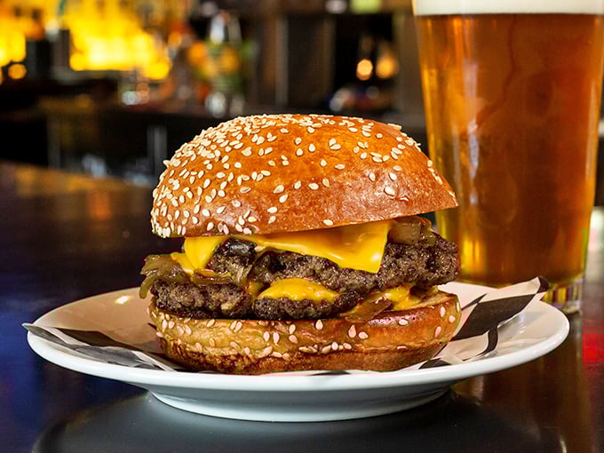 A burger that requires both hands, a stack of napkins, and possibly a signed liability waiver. Worth every delicious calorie and chin drip.