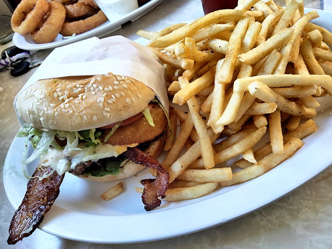 The burger that launched a thousand road trips, complete with crispy fries that deserve their own fan club.