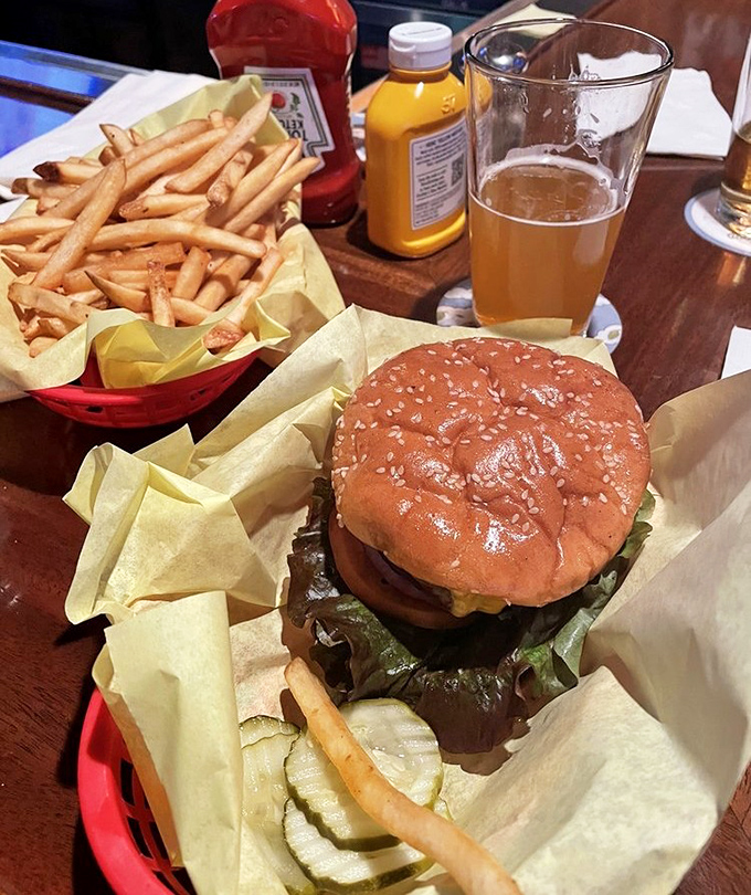 The holy trinity of pub perfection: a juicy burger, golden fries, and a cold beer. Simplicity elevated to an art form that needs no filter.