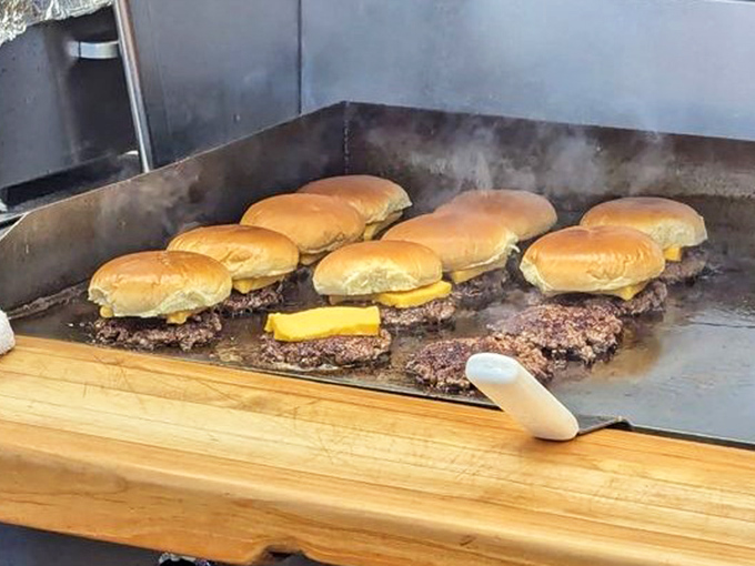 Burger alchemy happening before your eyes. That sizzle is the sound of ordinary beef becoming extraordinary memories.