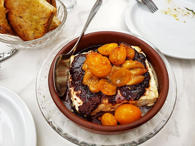 This isn't just burrata&mdash;it's a creamy cloud resting on a bed of roasted tomatoes, waiting to be smeared on crusty bread and transported directly to food heaven.