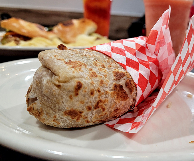 The burrito – where tortilla meets engineering. Perfectly grilled, expertly wrapped, and ready to transport you to flavor country.