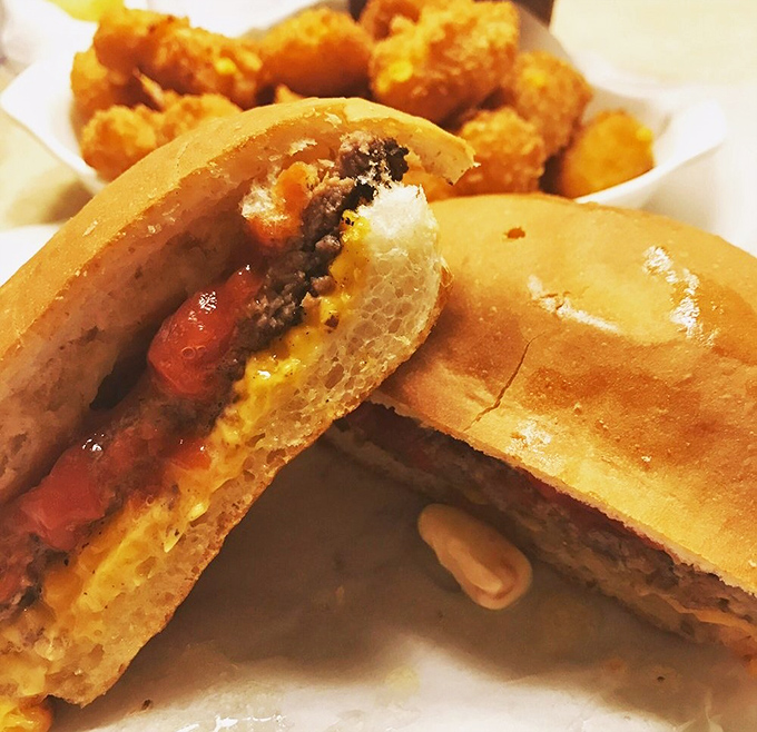 The legendary butter burger in its natural habitat—where the bun is hard, the beef is chargrilled, and calories don't count on game day.