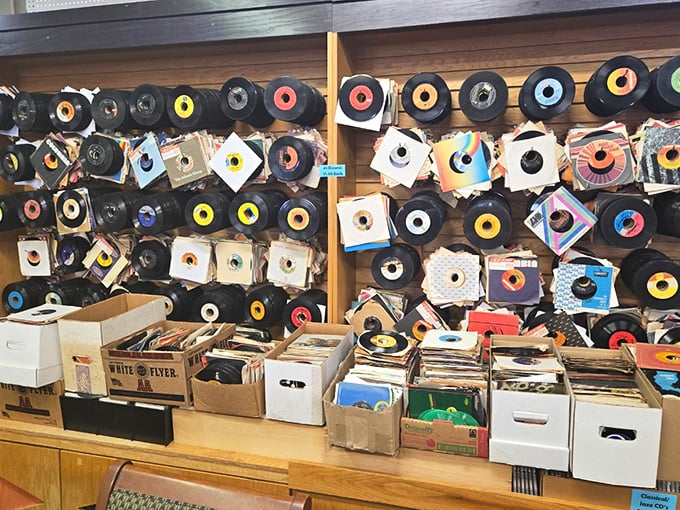 The wall where 45s become art. These colorful vinyl singles create a mosaic of musical memories, each disc a portal to another era.