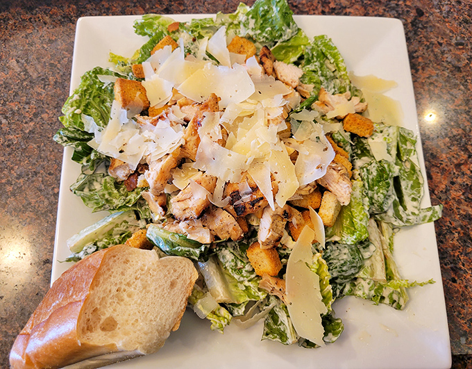 Caesar salad: the noble attempt to balance your diet before demolishing an entire pizza. The croutons alone are worth the trip. 