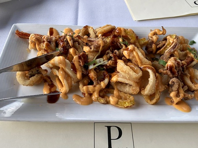 Calamari elevated beyond the typical bar food, drizzled with sauce that makes you want to lick the plate when nobody's looking.