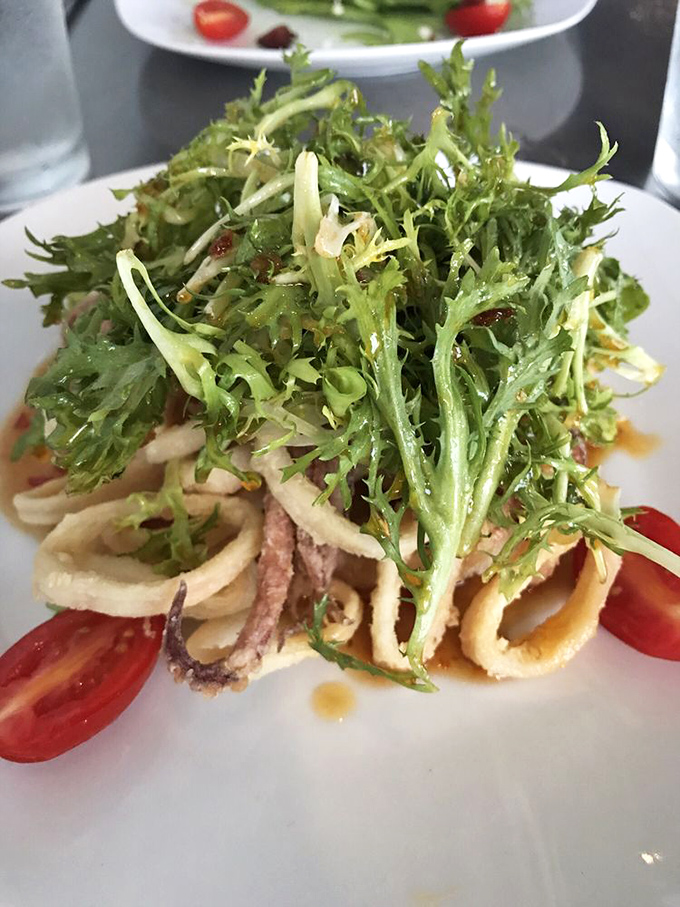Calamari that didn't get the memo about being rubbery. This tender seafood salad is summer on a plate.