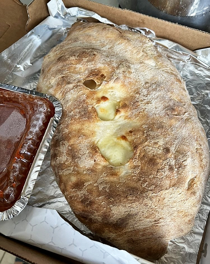 The calzone at Fiori's isn't just a meal&mdash;it's an event. This golden-brown behemoth could feed a family or one very determined Pennsylvanian.